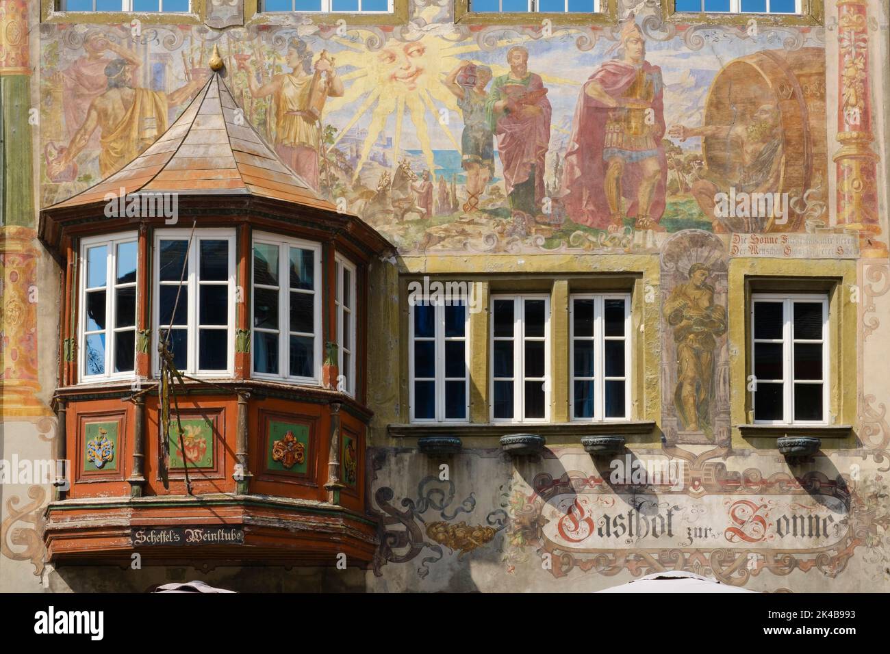 Bay window on painted facade, Historic House on Town Hall Square ...