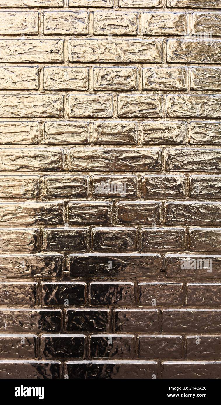 Texture of a golden brick wall Stock Photo - Alamy