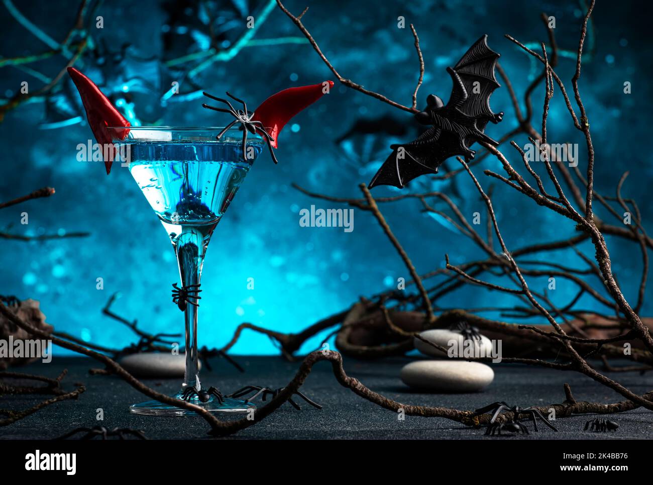 Halloween alcoholic cocktail evil martini on scary dark blue background ...