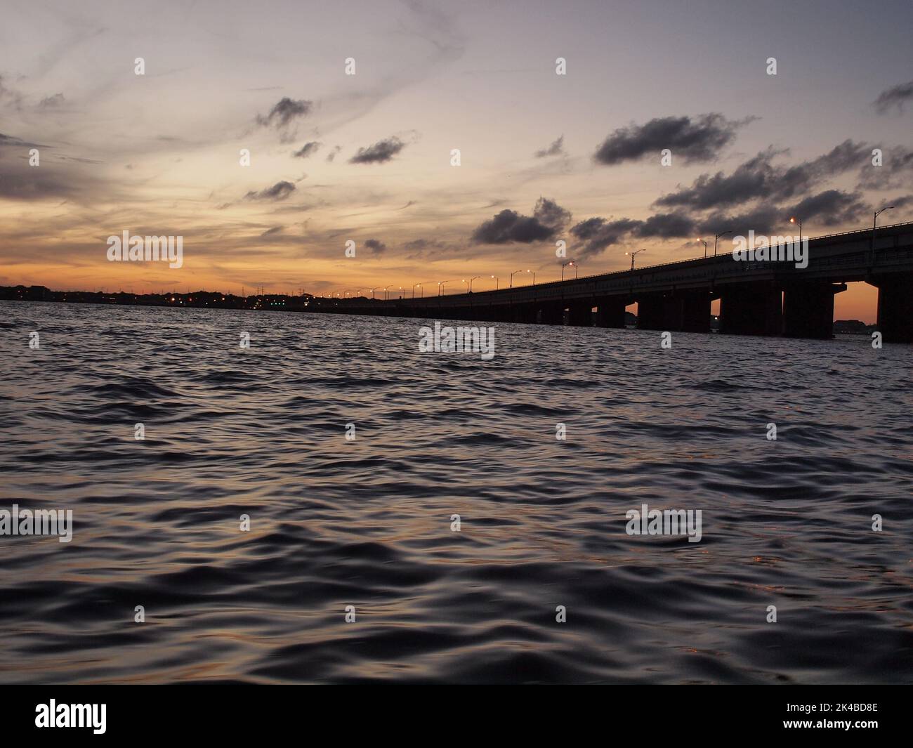 Late afternoon sunset over Barnegat Bay, New Jersey. The bridge is the ...