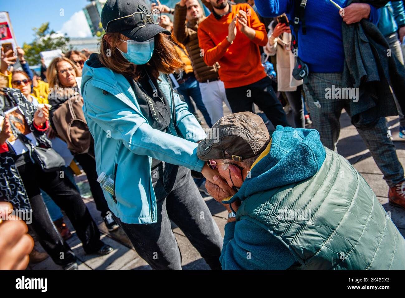 An Iranian man is seen kissing the hand of an Iranian woman after ...