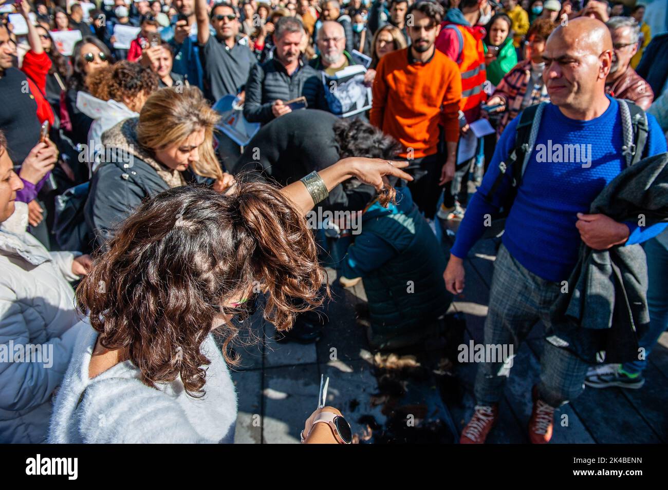 Several Iranian women are seen cutting off their hair during the ...