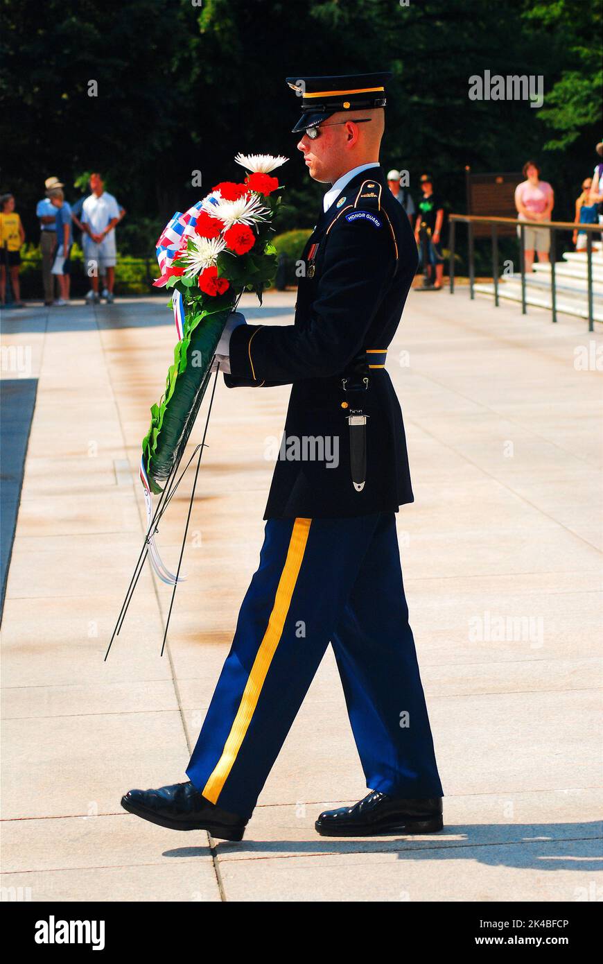 An honor guard soldier lays a wreath at the Tomb of the Unknown Soldier ...
