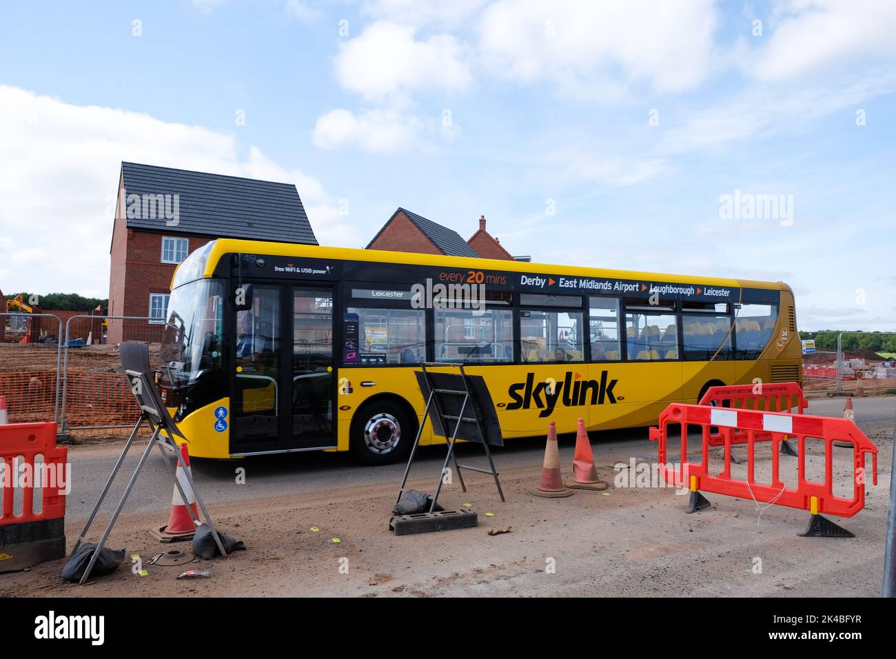 skylink bus driving through roadworks Stock Photo - Alamy