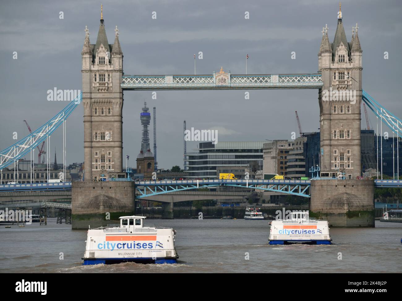 City Cruises' London sightseeing boats on the river Thames heading ...