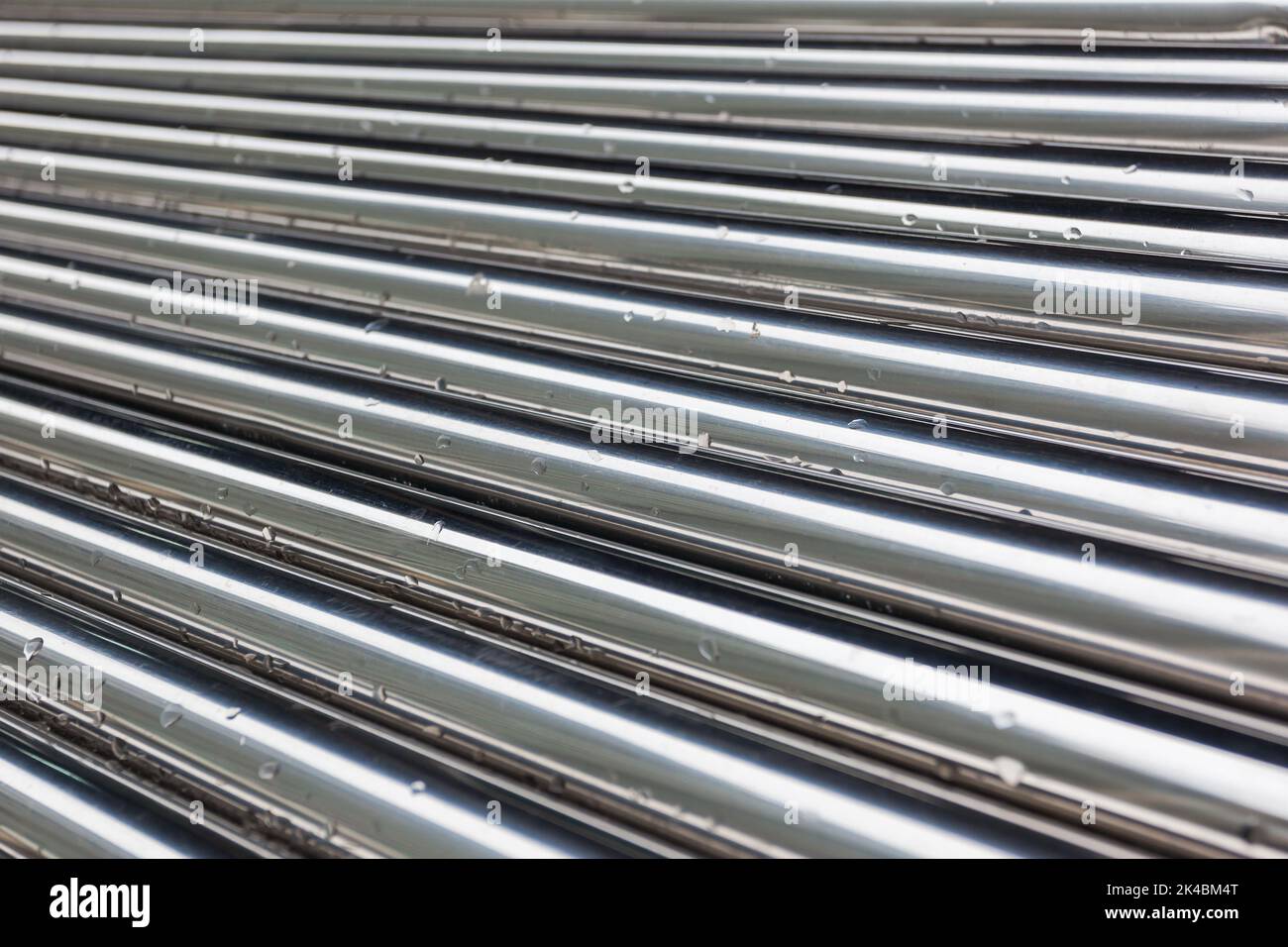 Chromized steel pipes - Industrial abstract background Stock Photo - Alamy