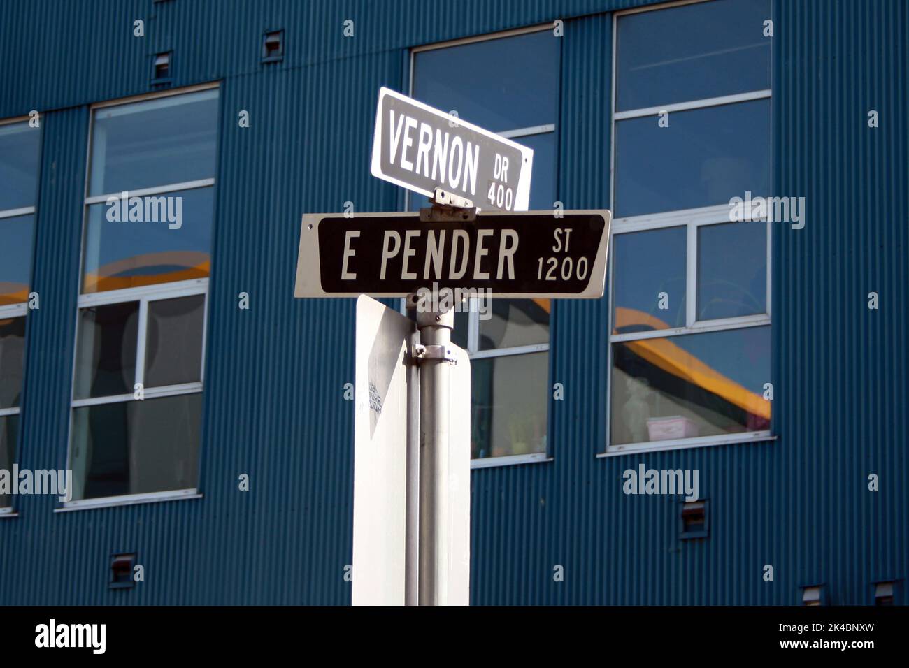 Intersection sign against building hi-res stock photography and images ...