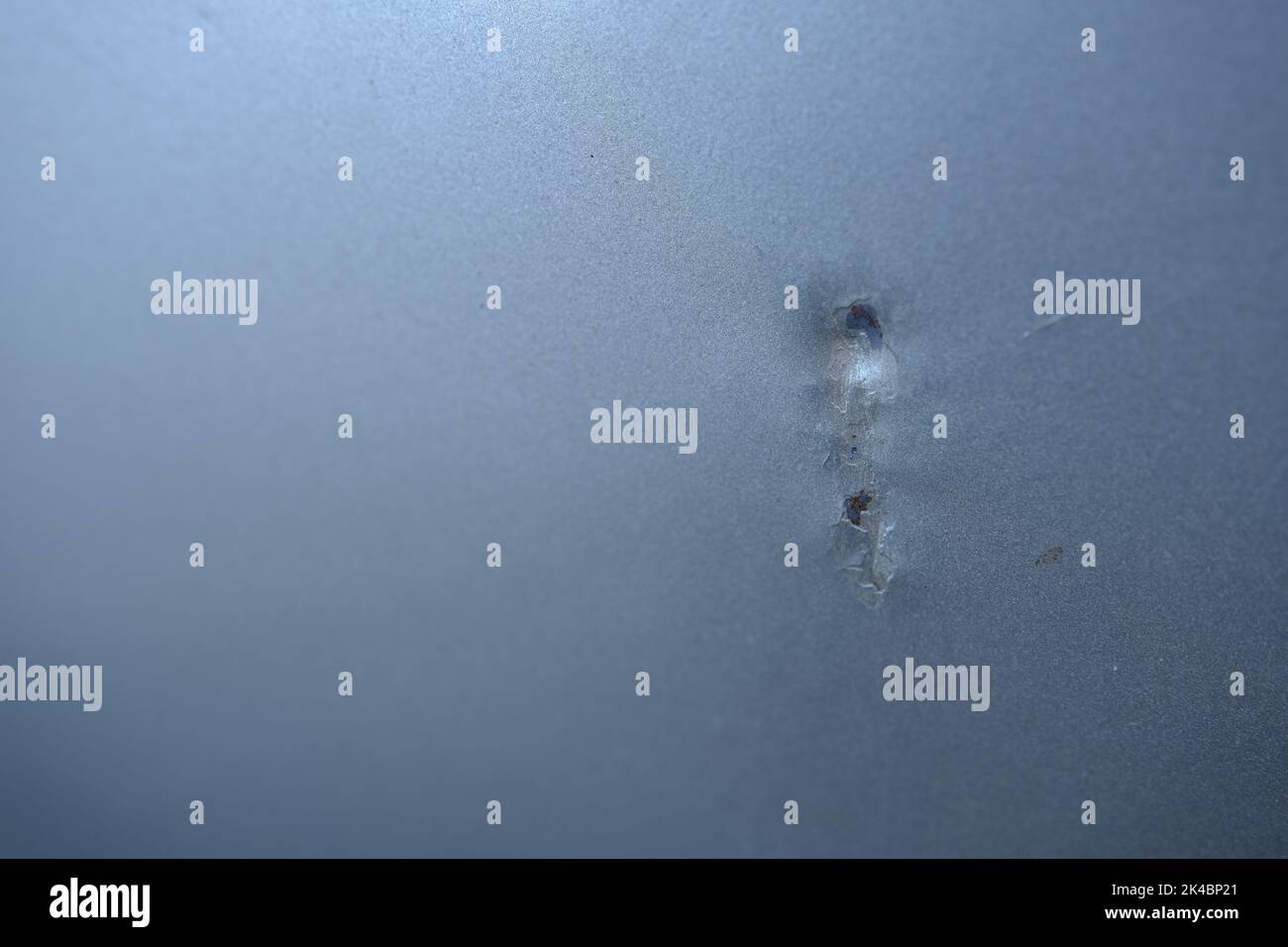 Scratched back bumper on the grey metallic car. Closeup image of ...