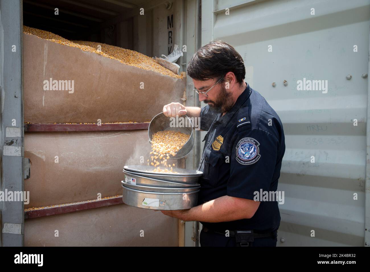 A CBP Agriculture Specialist inspects grain shipments at the Baltimore ...