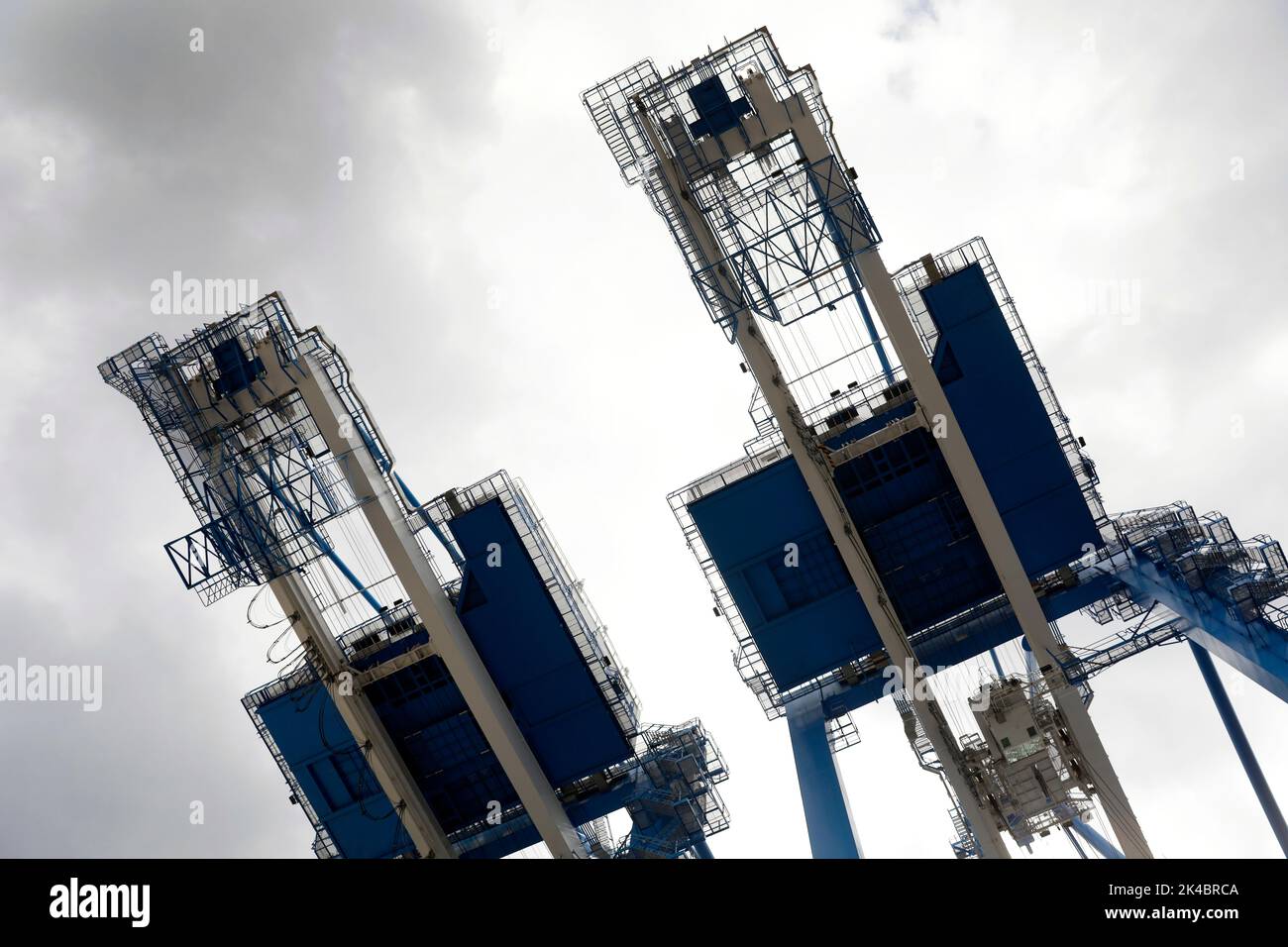 Massive cranes sit ready to offload incoming cargo ships at the Port of ...
