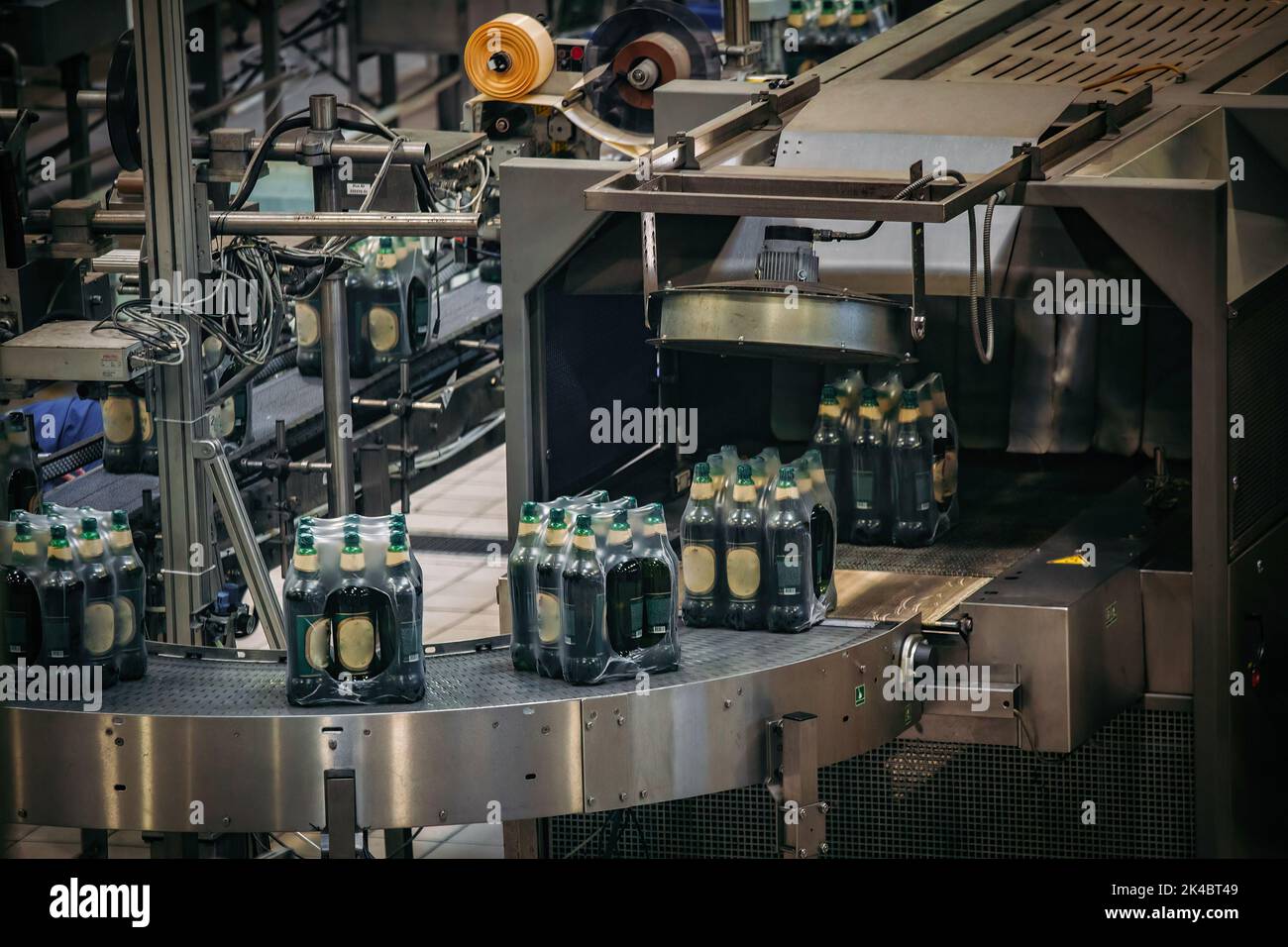 Modern automated beer bottling packing production line Stock Photo - Alamy