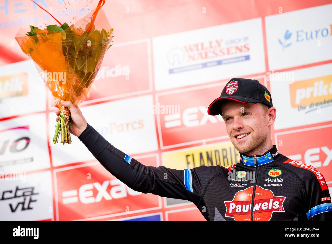 Belgian Eli Iserbyt celebrates on the podium after the men's elite race ...