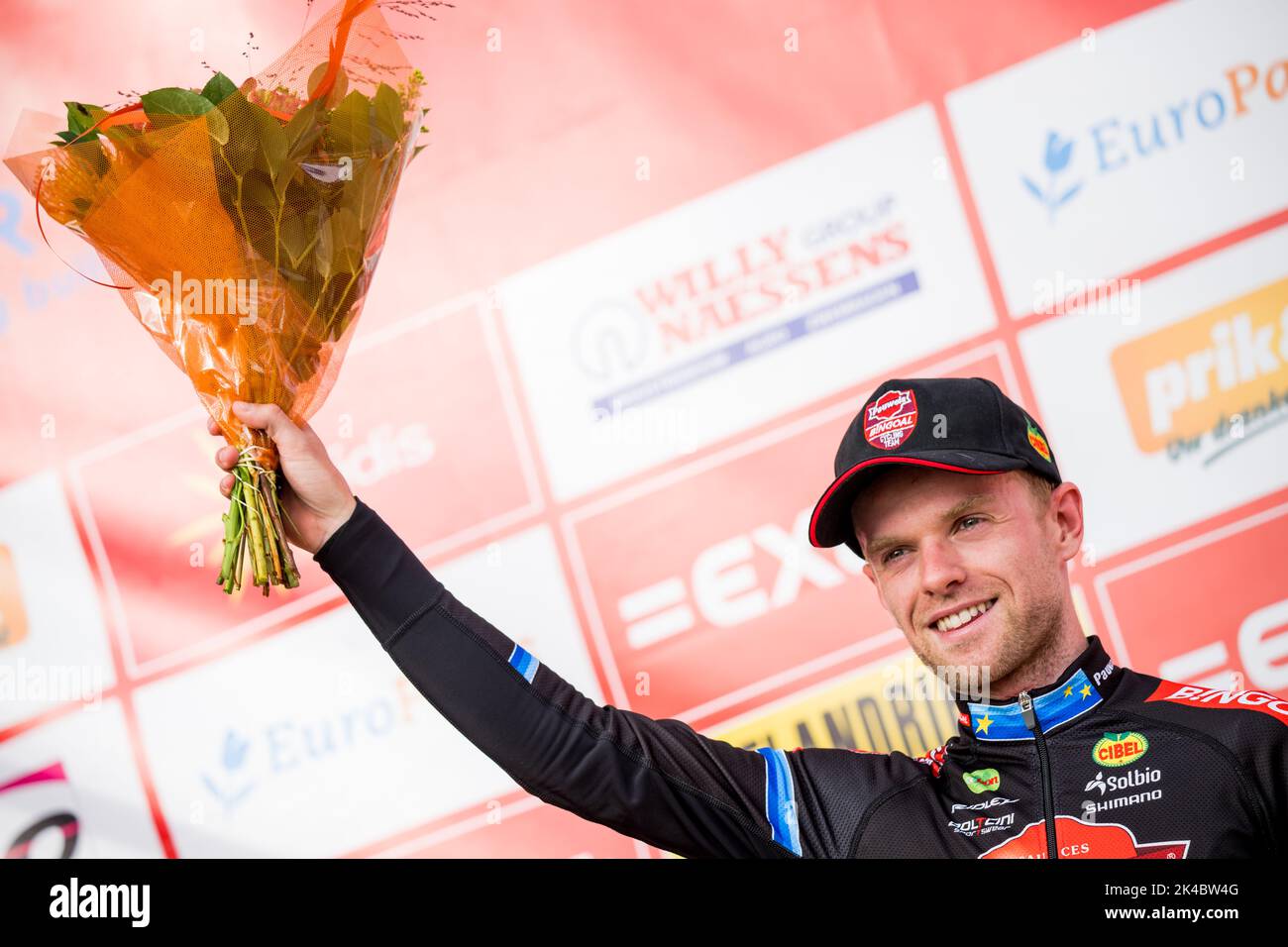 Belgian Eli Iserbyt celebrates on the podium after the men's elite race ...
