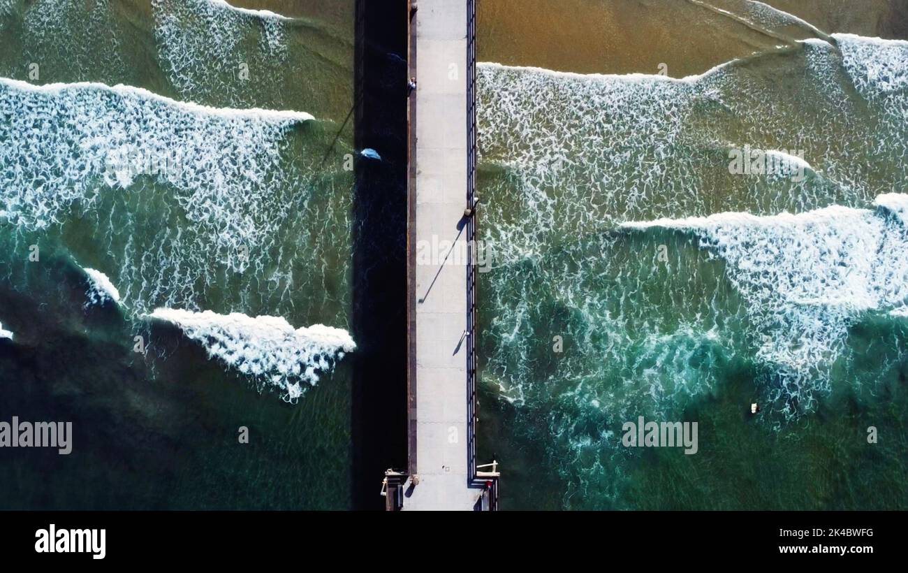 An aerial top view of the pear over the beach Stock Photo - Alamy