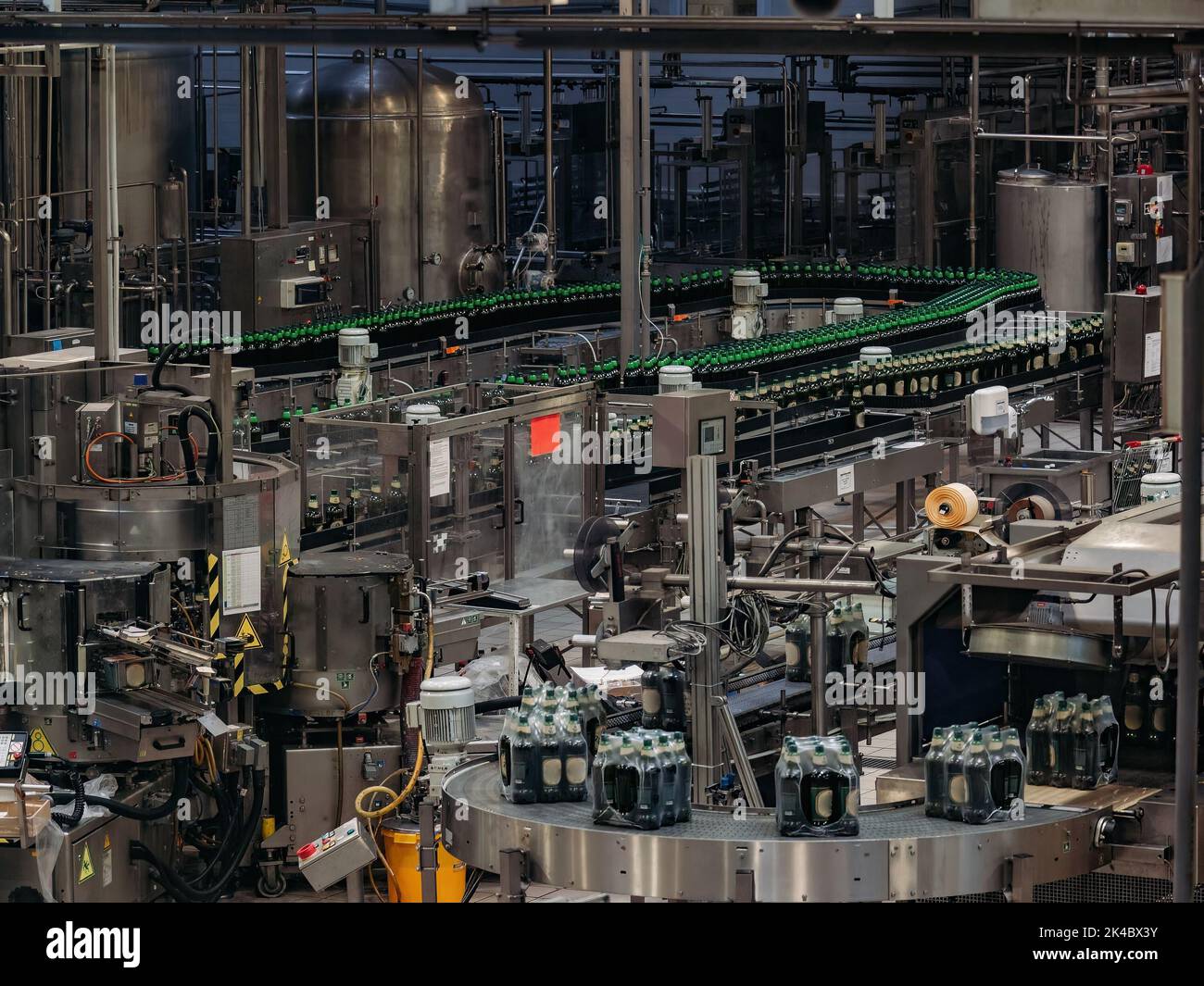 Modern automated beer bottling packing production line Stock Photo - Alamy