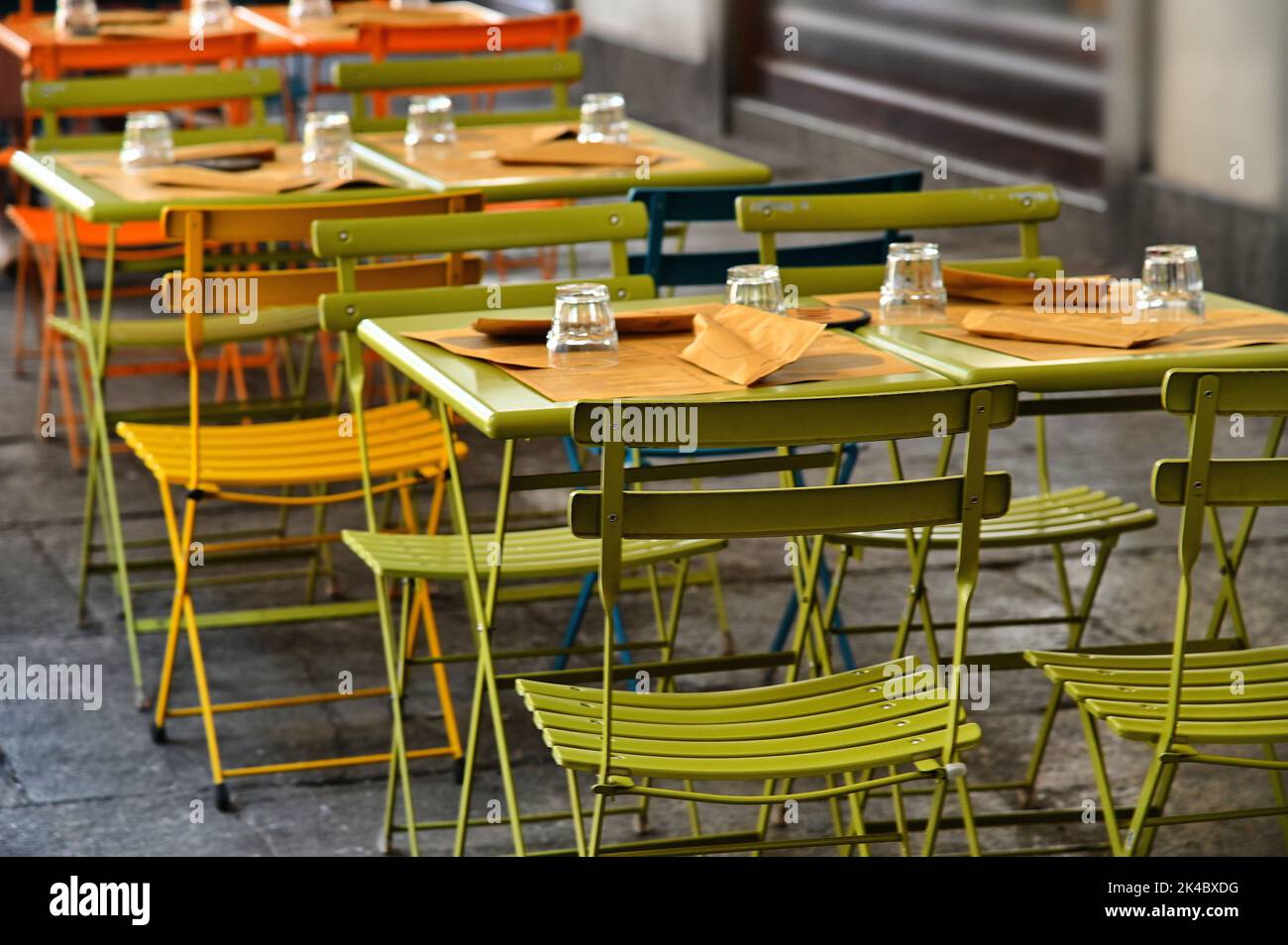 The empty restaurant tables set in the terrace waiting customers for ...