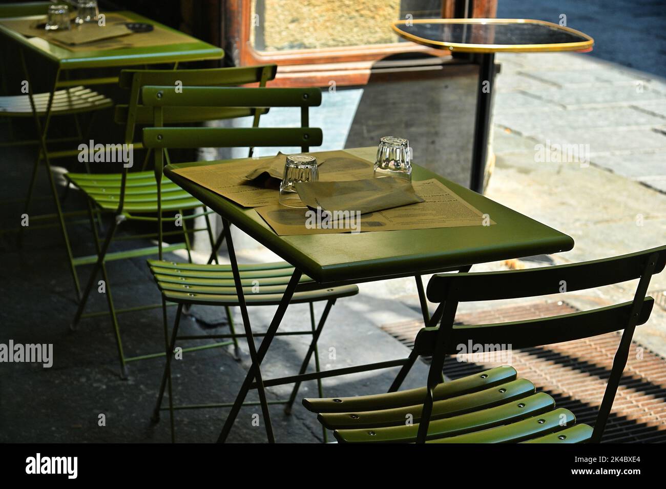 The empty restaurant tables set in the terrace waiting customers for ...