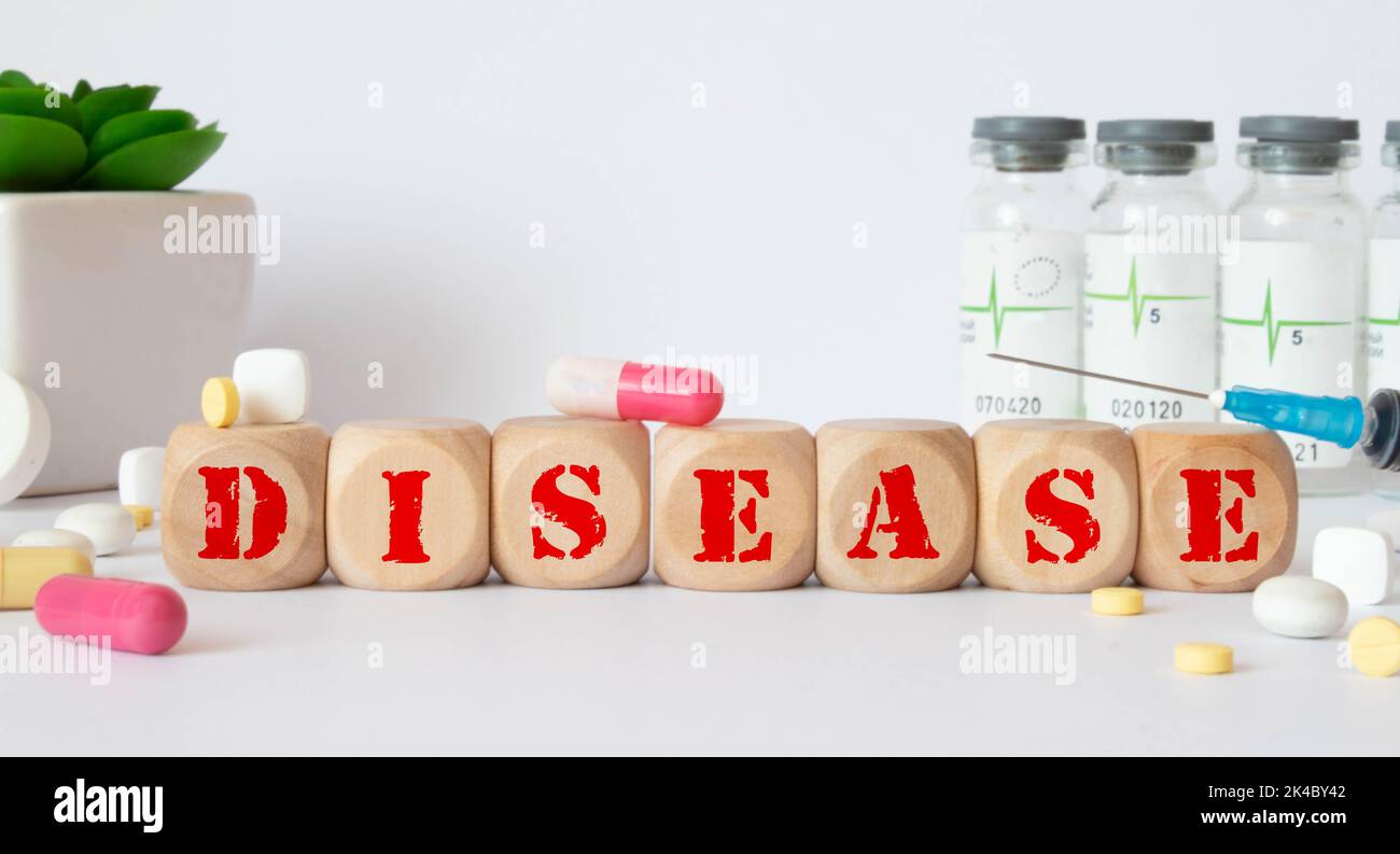 Tile alphabet letter in word disease on wood background Stock Photo - Alamy