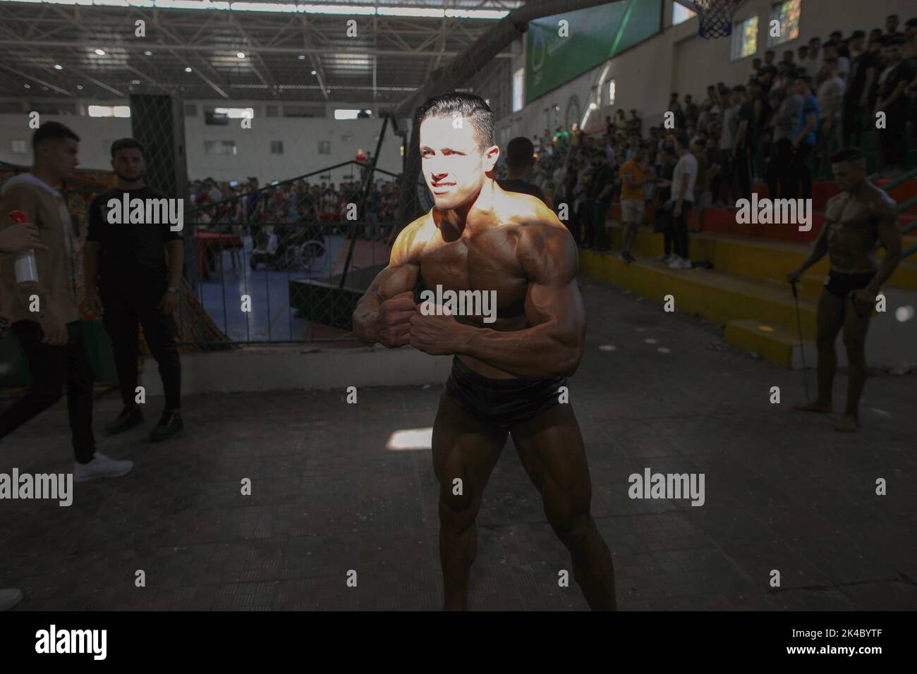 A Palestinian athlete displays his skills before taking part in a local ...