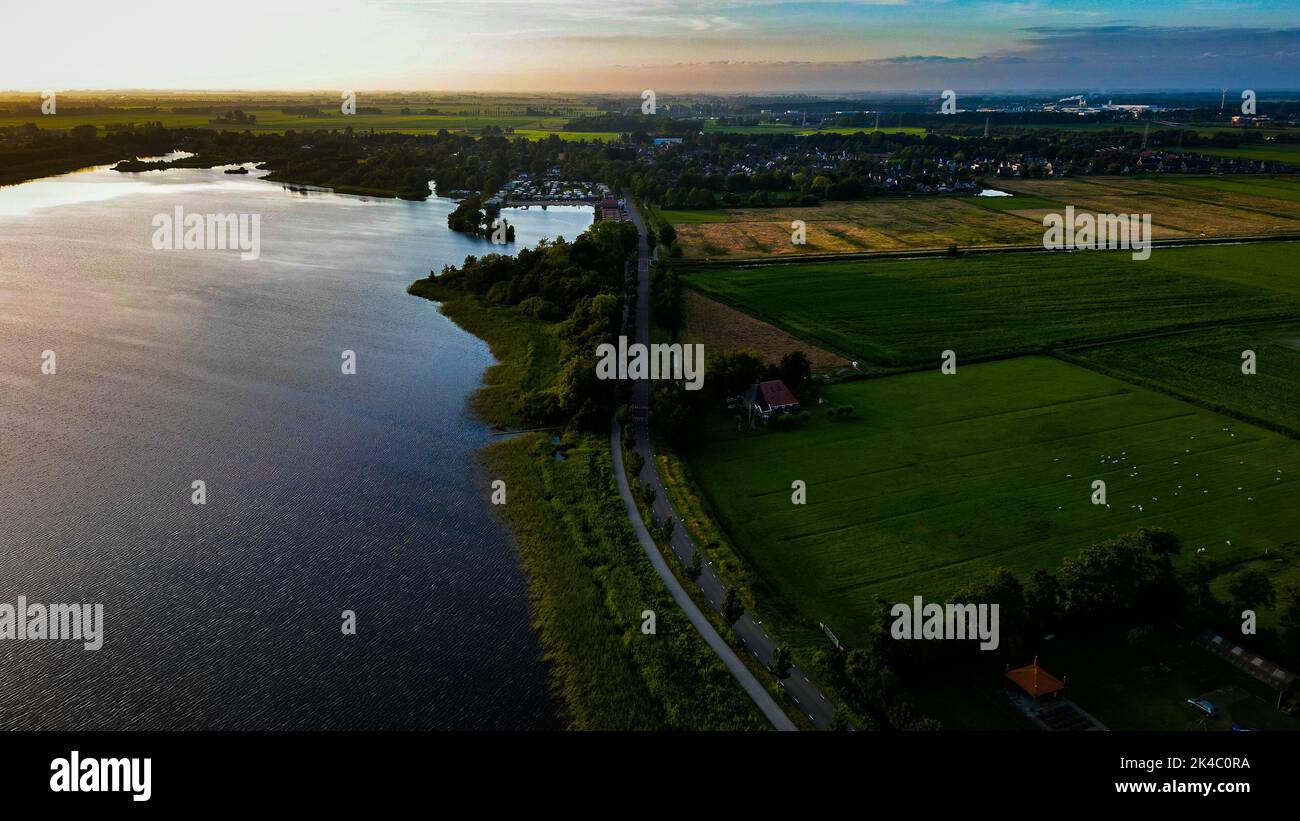 An aerial view of an open field next to the lake of Nannewiid in the ...