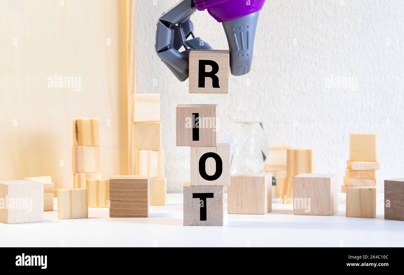Riot - word from wooden blocks with letters, noisy and violent public ...