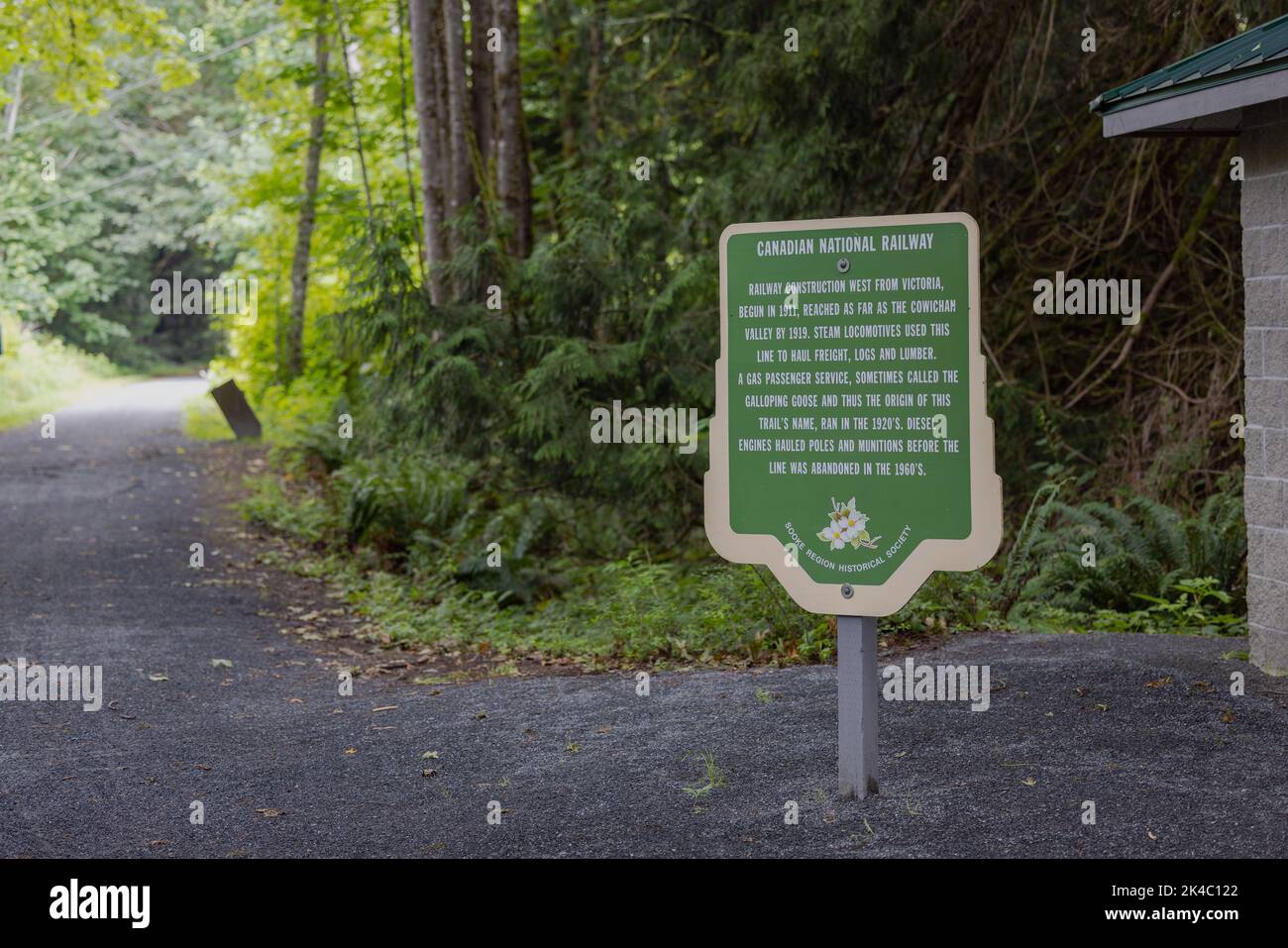 A green sign about the Canadian national railway and brief information ...