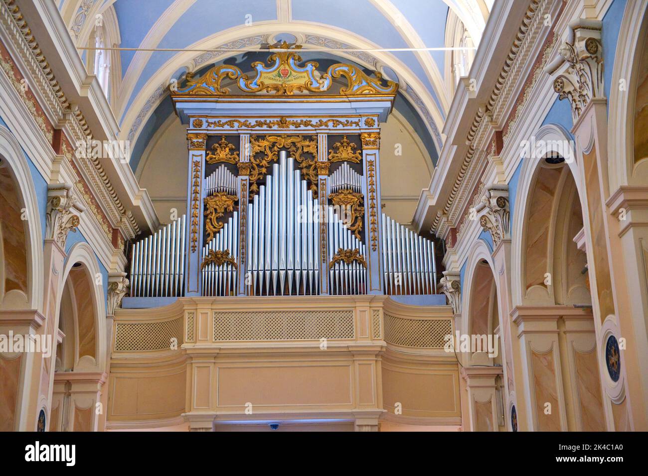 The richly decorated organ pipes in the interior of the Church of Saint Gabriel in Teramo, Italy ...