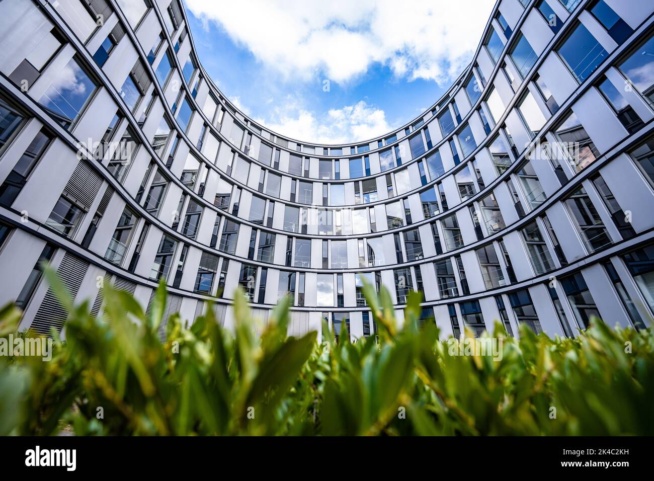 An architecture building Hamburger Welle with plants in front Stock ...
