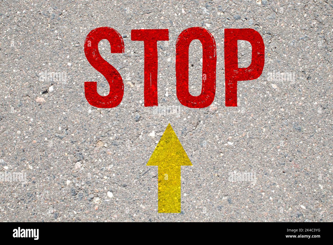 bright white road sign uppercase capital letter STOP and direction ...