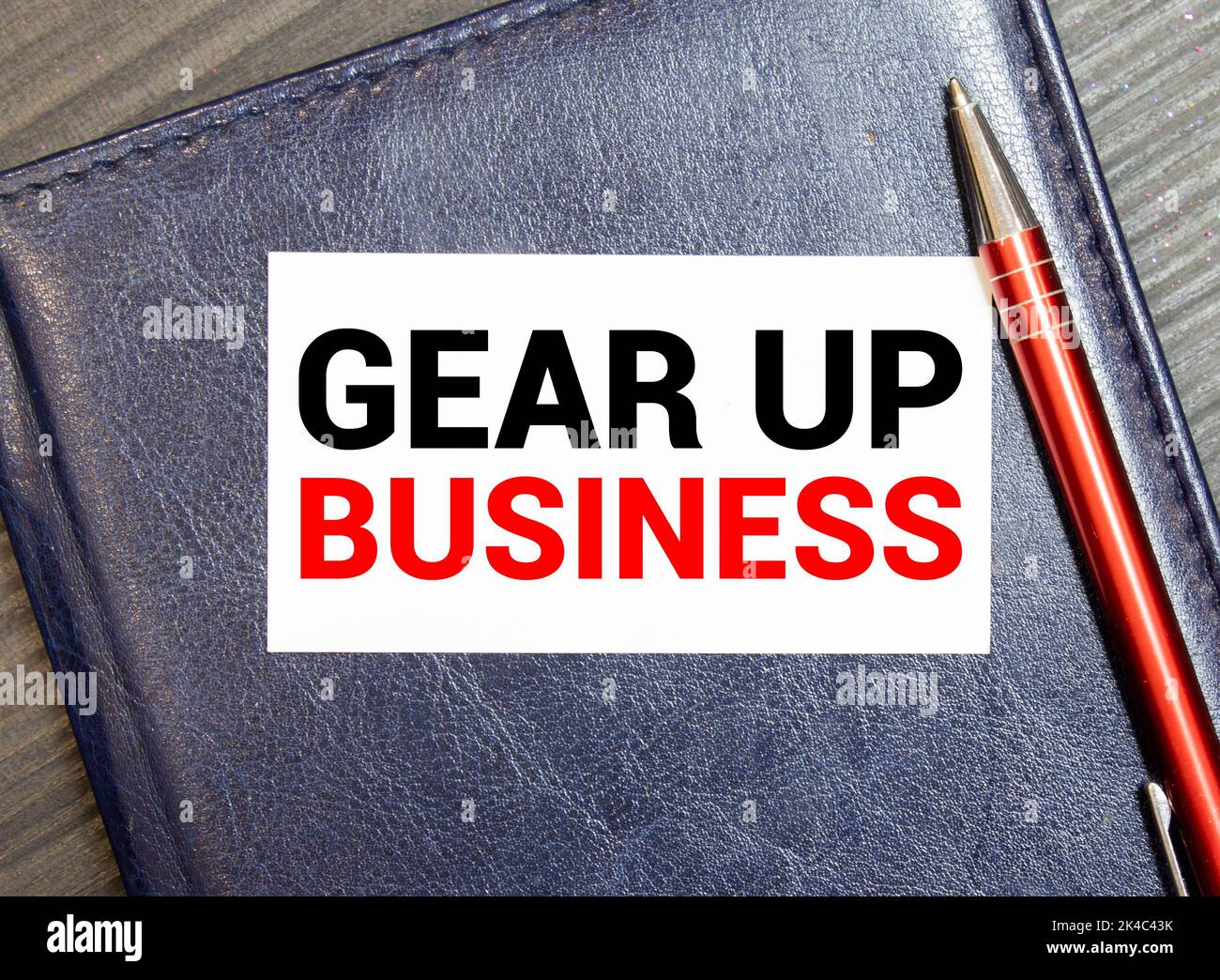white paper with text Gear Up Business on a black background with ...