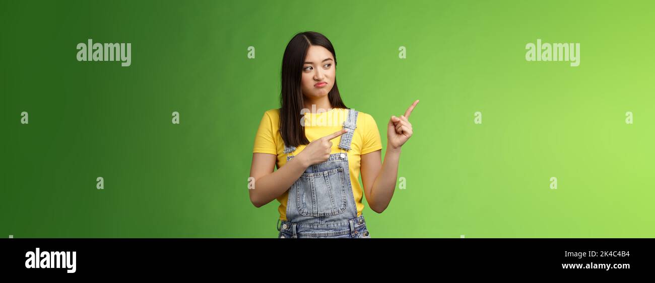 Upset cute asian female student pulling face regret shame, pity missing ...