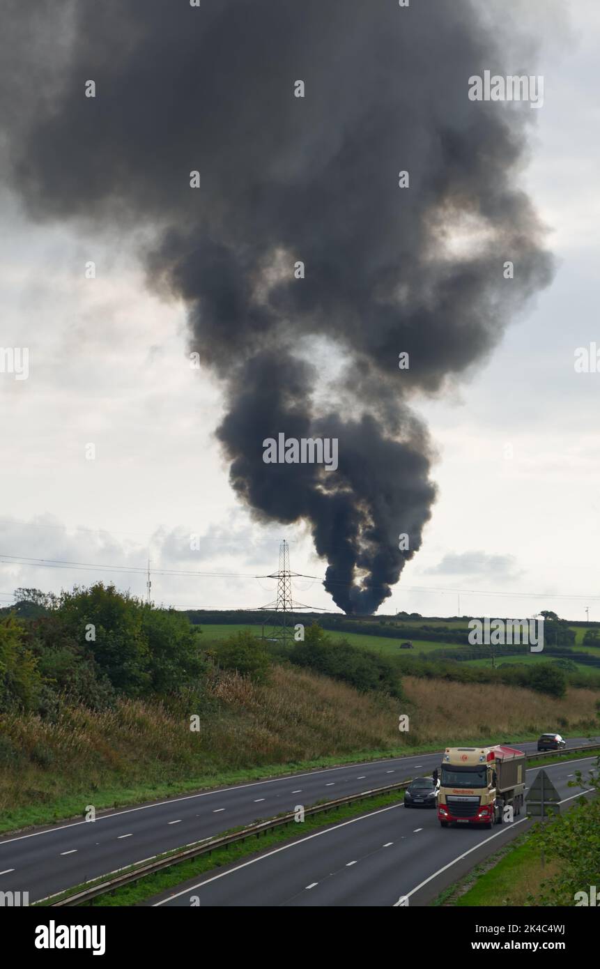 Tractor and hay baler had caught fire causing black smoke Stock Photo ...