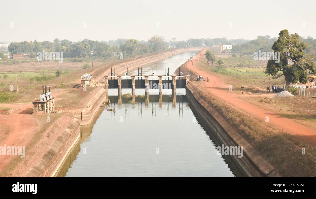 An opened canal gate on a long canal in Chhattisgarh Stock Photo - Alamy