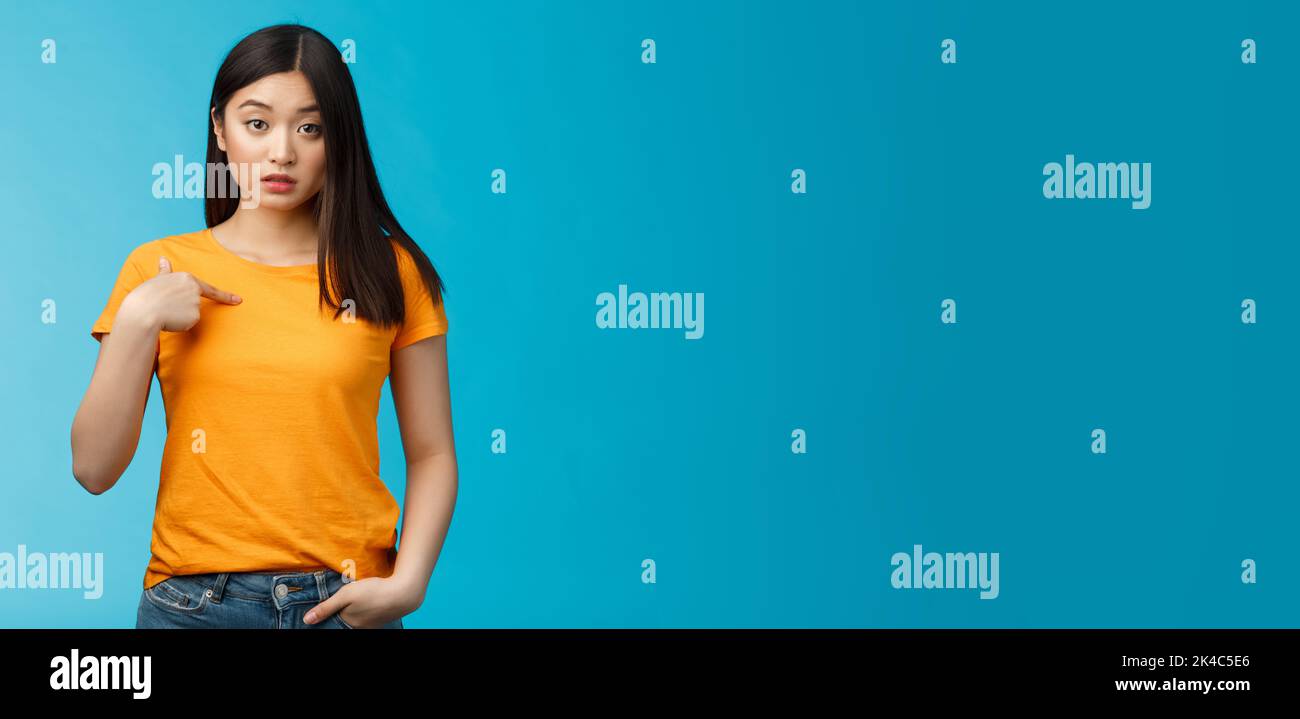 Surprised cute asian urban female student pointing herself look ...