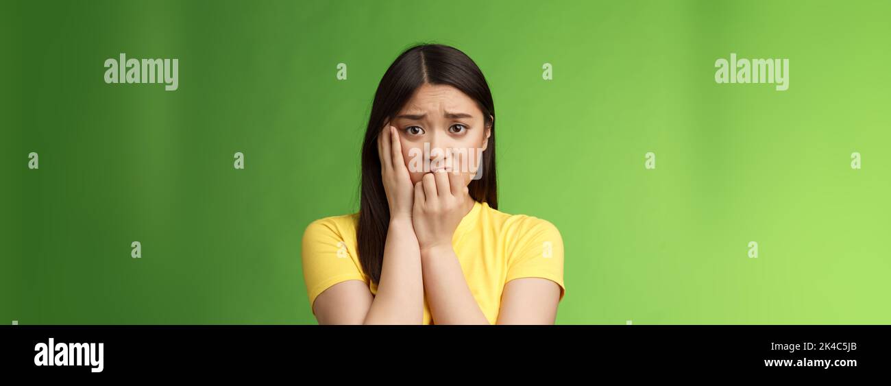 Innocent insecure timid asian scared girl panicking, standing afraid ...