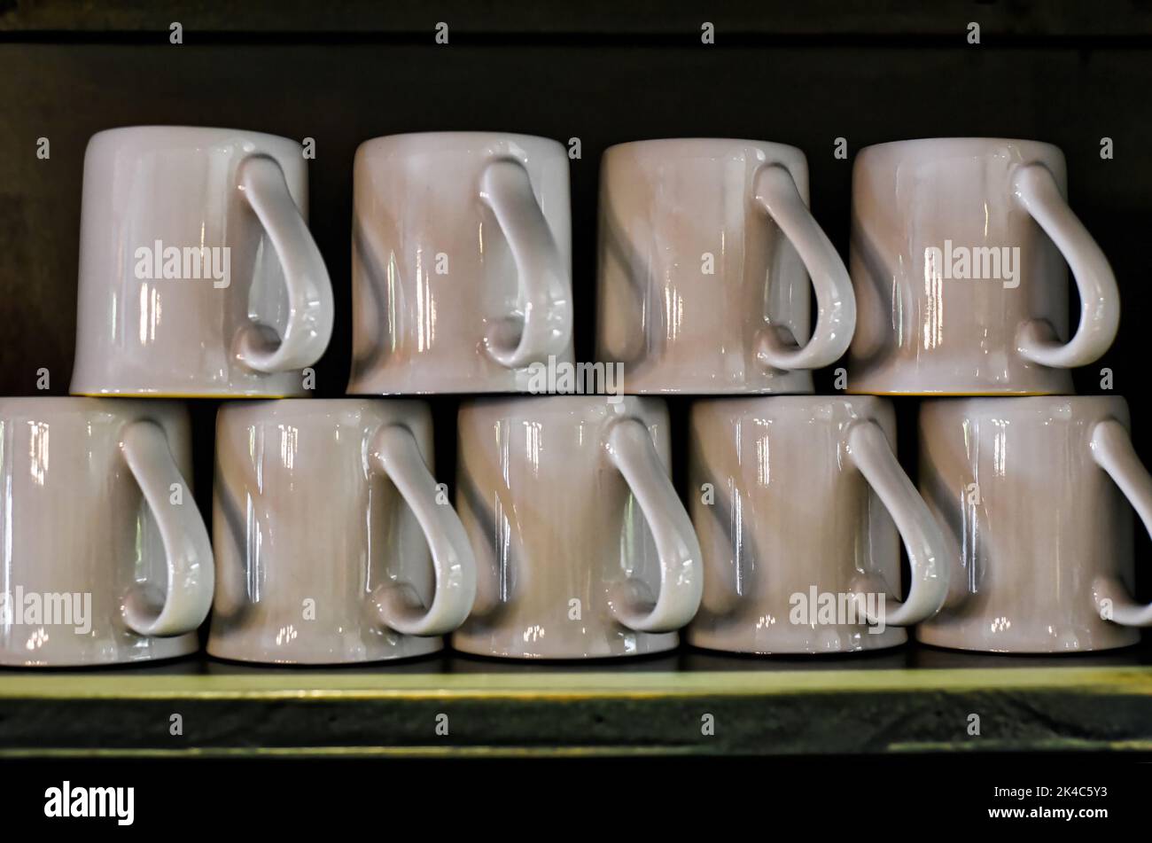 Many mugs in a row as decor for interior Stock Photo - Alamy