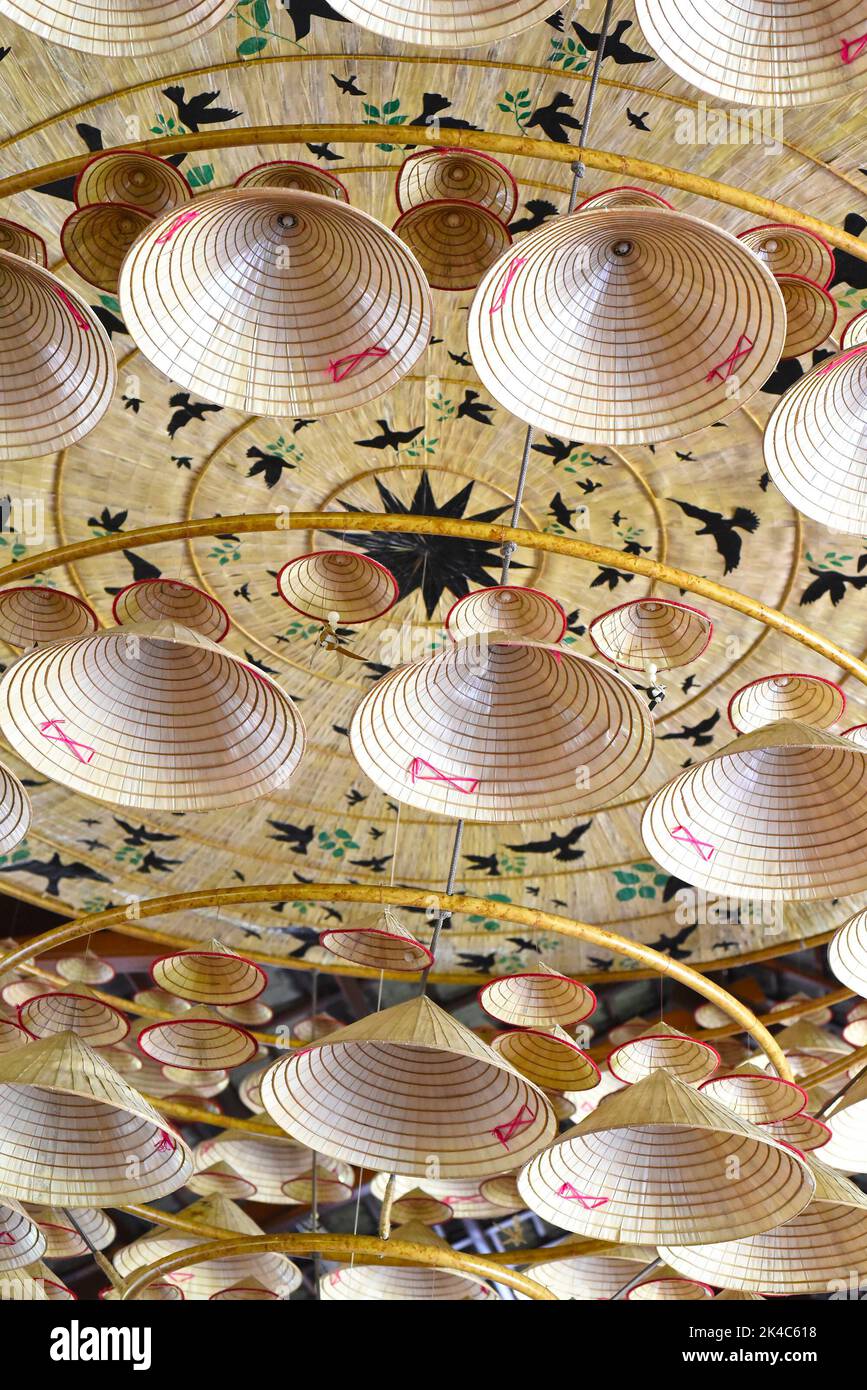 Many similar traditional Vietnamese conical hats attached to the ...