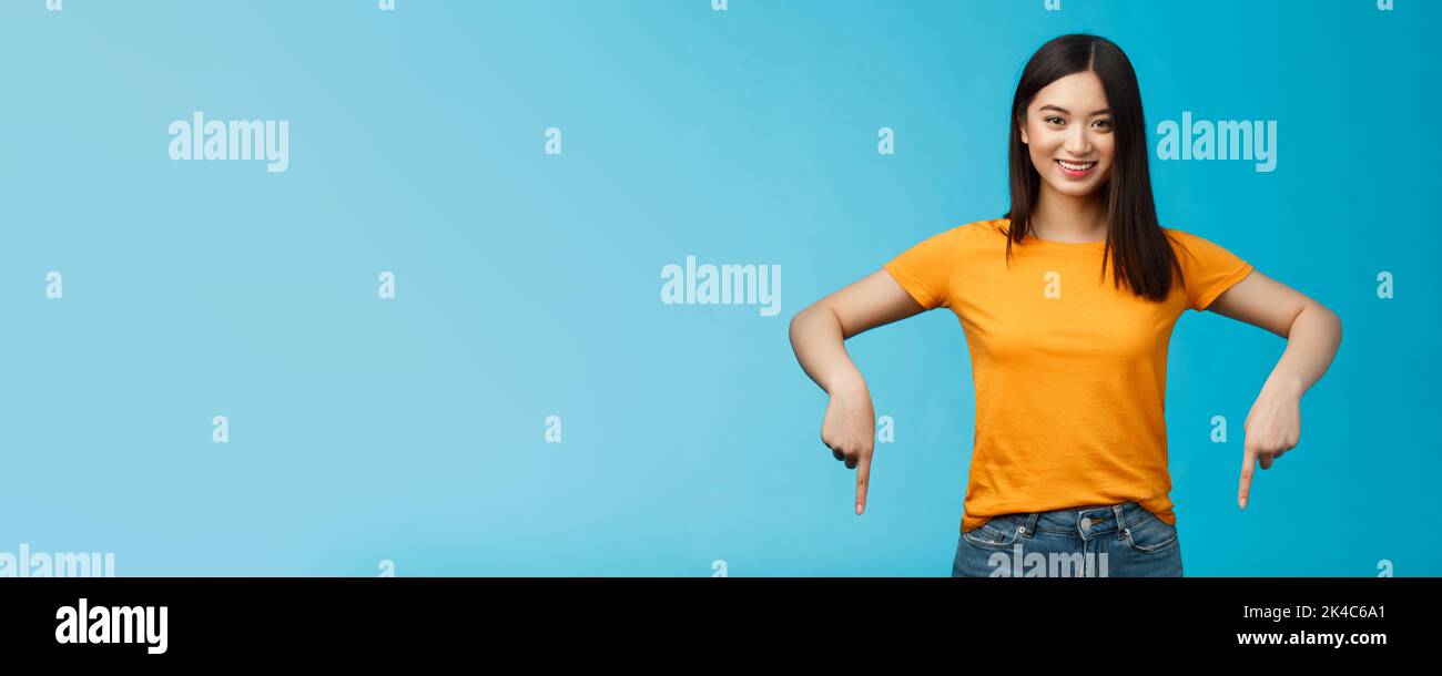 Cheerful self-assured asian girl dark haitcut wear yellow summer t ...