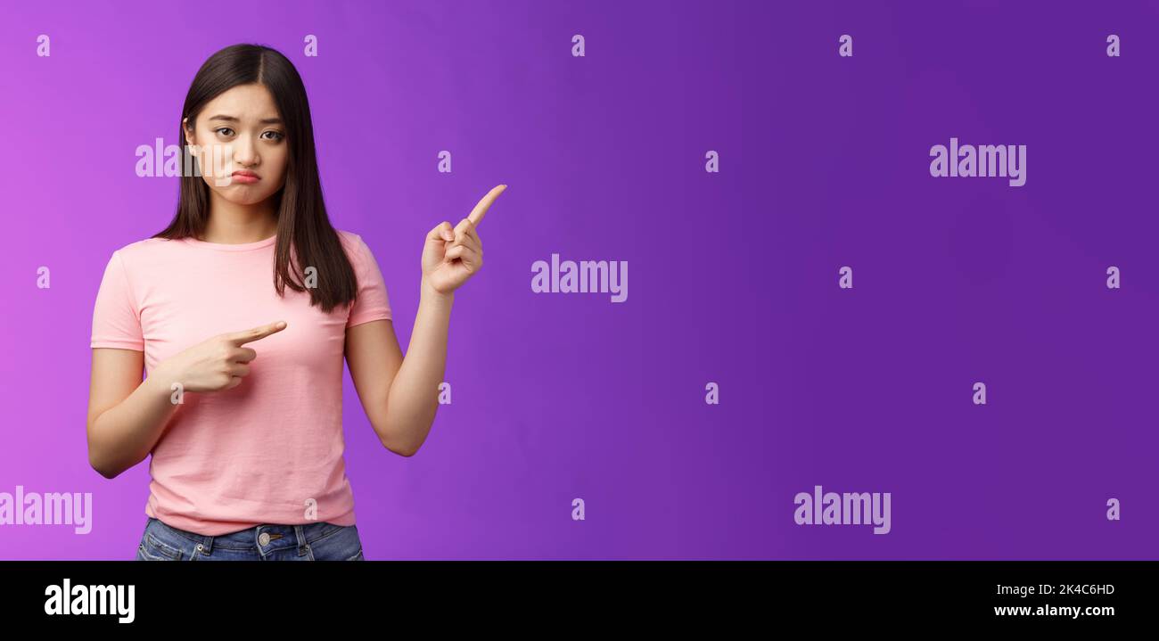 Upset unlucky cute sulking asian girl losing competition, pouting ...