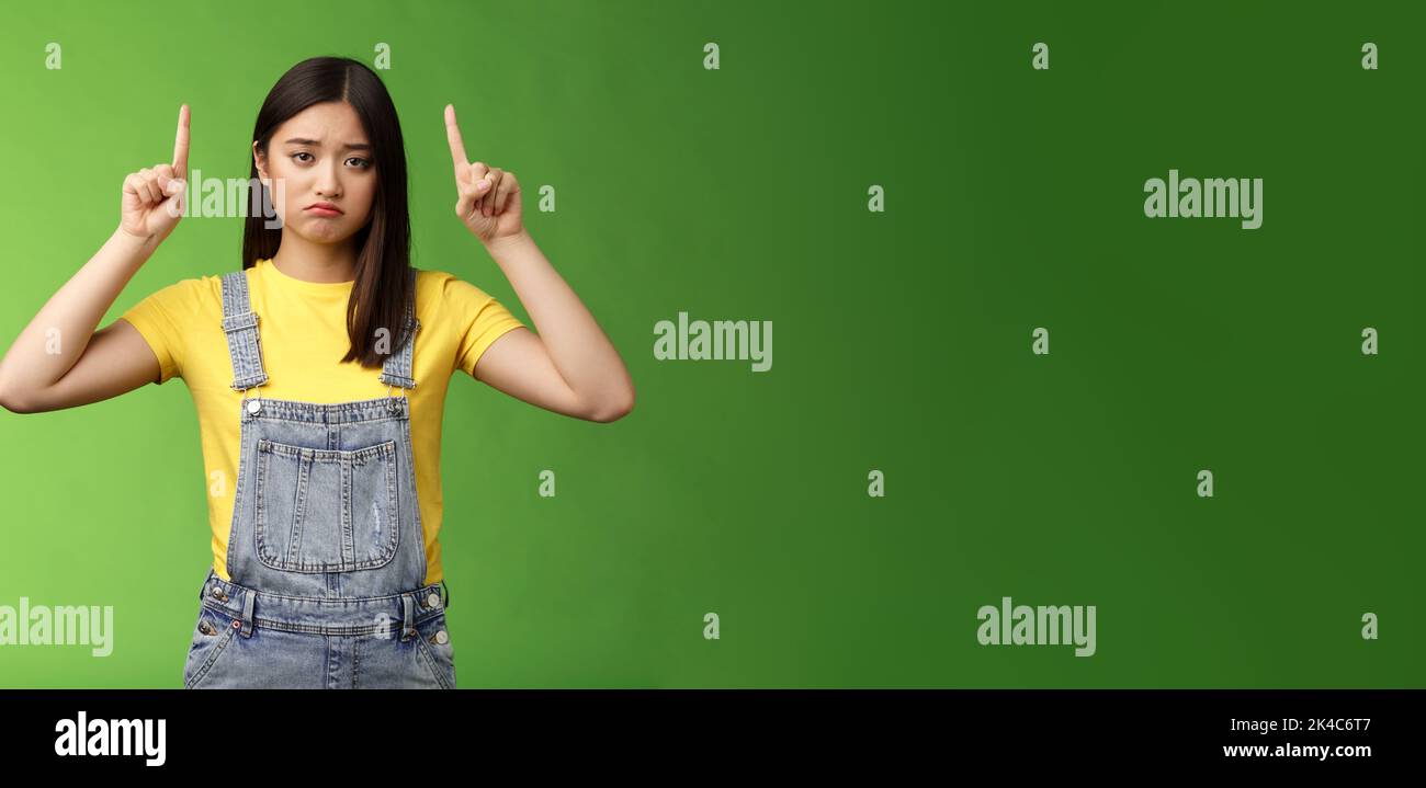 Pity cute sad asian girl brunette, grimacing pulling sorrow upset face ...