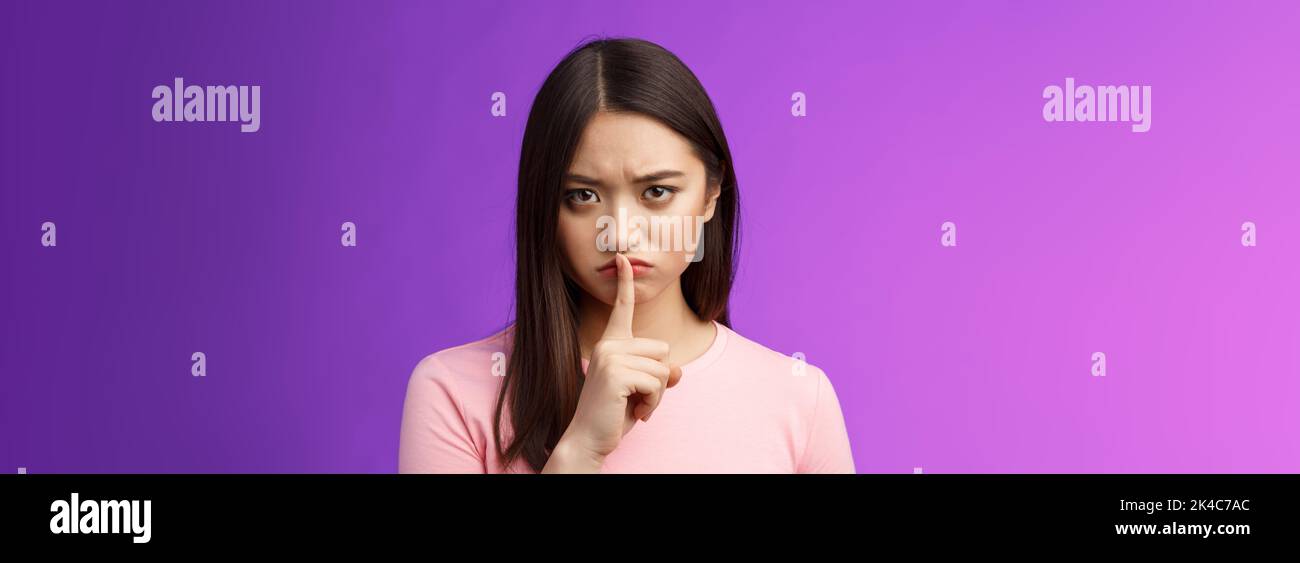 Close-up offended serious-looking upset asian young girl frowning ...