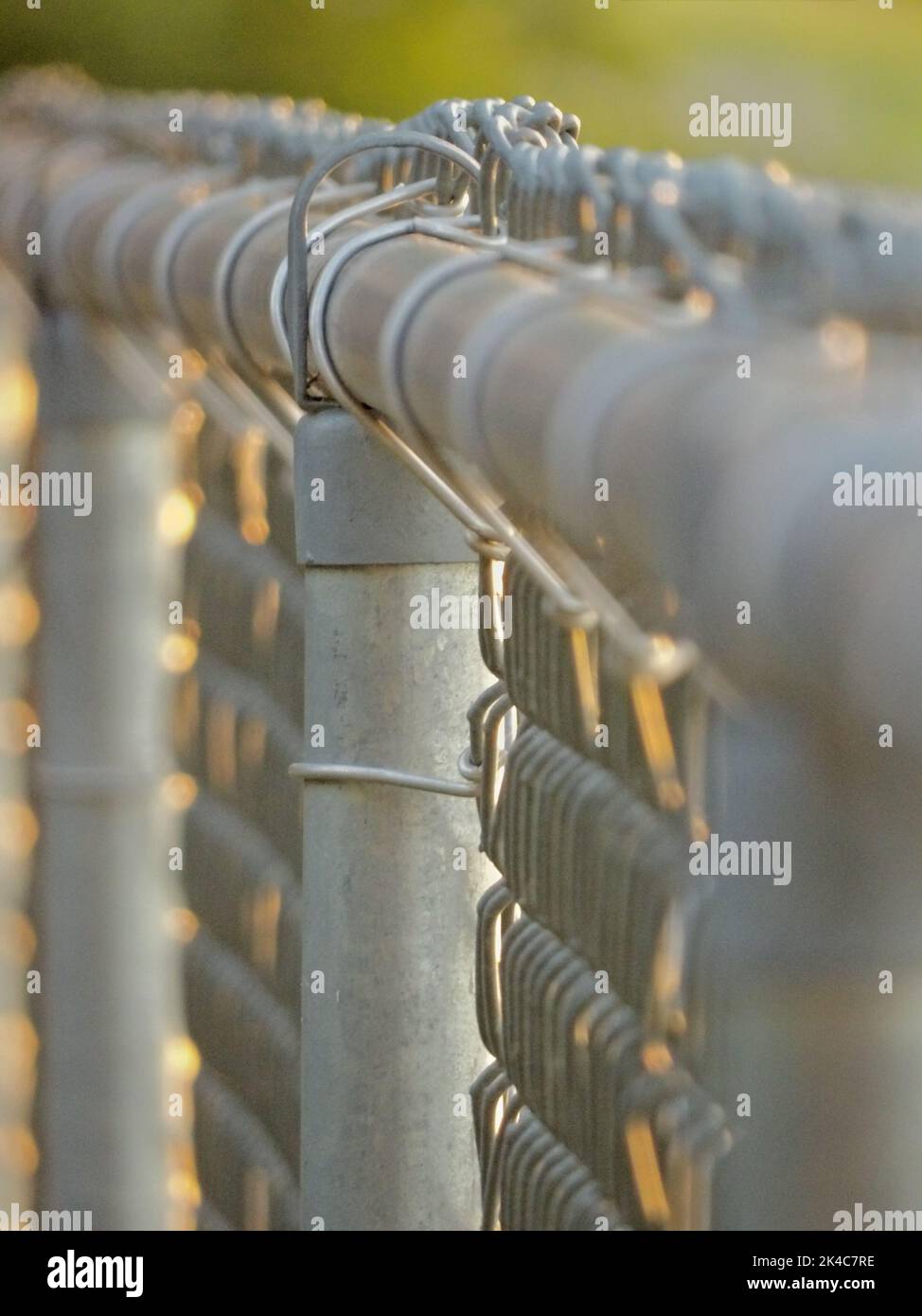 A vertical shot of chain link metal fence Stock Photo - Alamy
