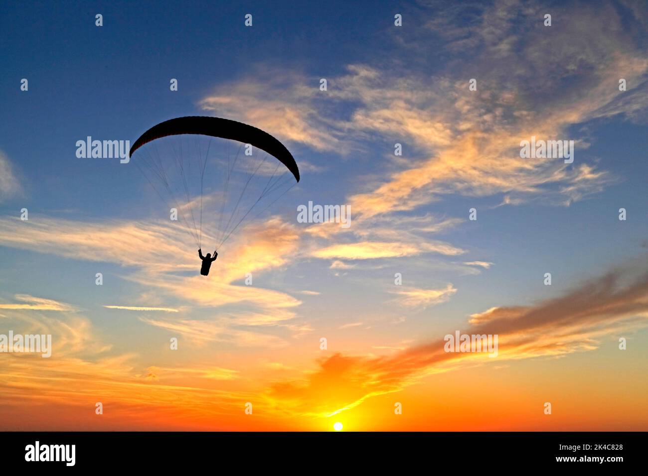 Hang Glider, parachute, against sunset, sky, Norfolk, England, UK Stock ...