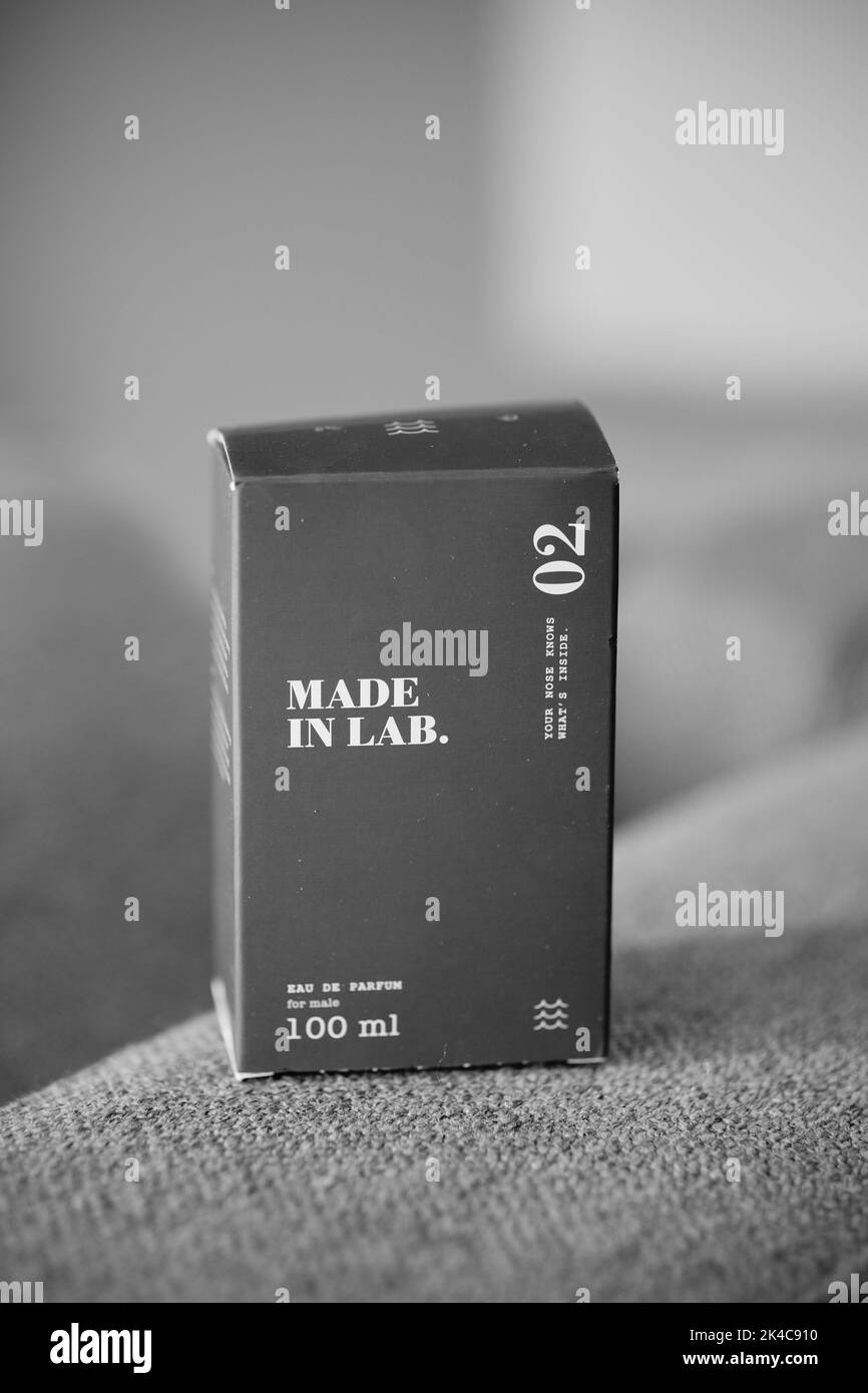 A grayscale vertical shot of a Made In Lab men perfume in a box Stock ...