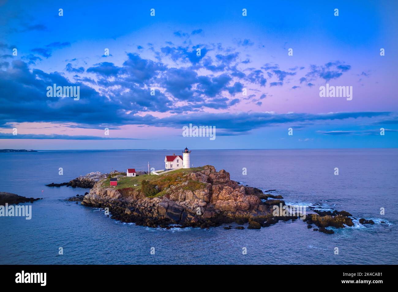 “Nubble Lighthouse and Moon” The Cape Neddick Lighthouse stands on ...
