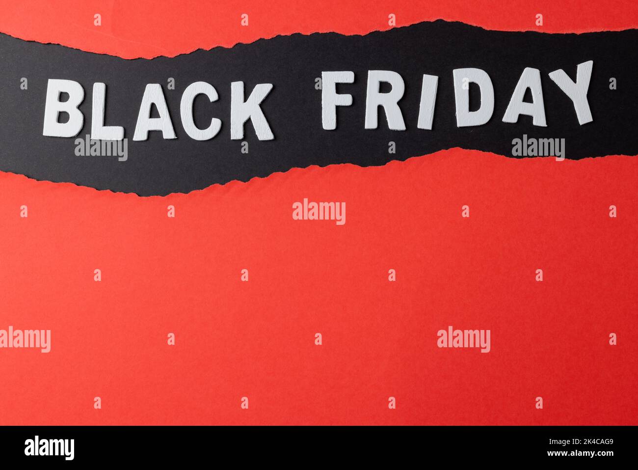 Composition of pink paper cards and black friday text on gray ...