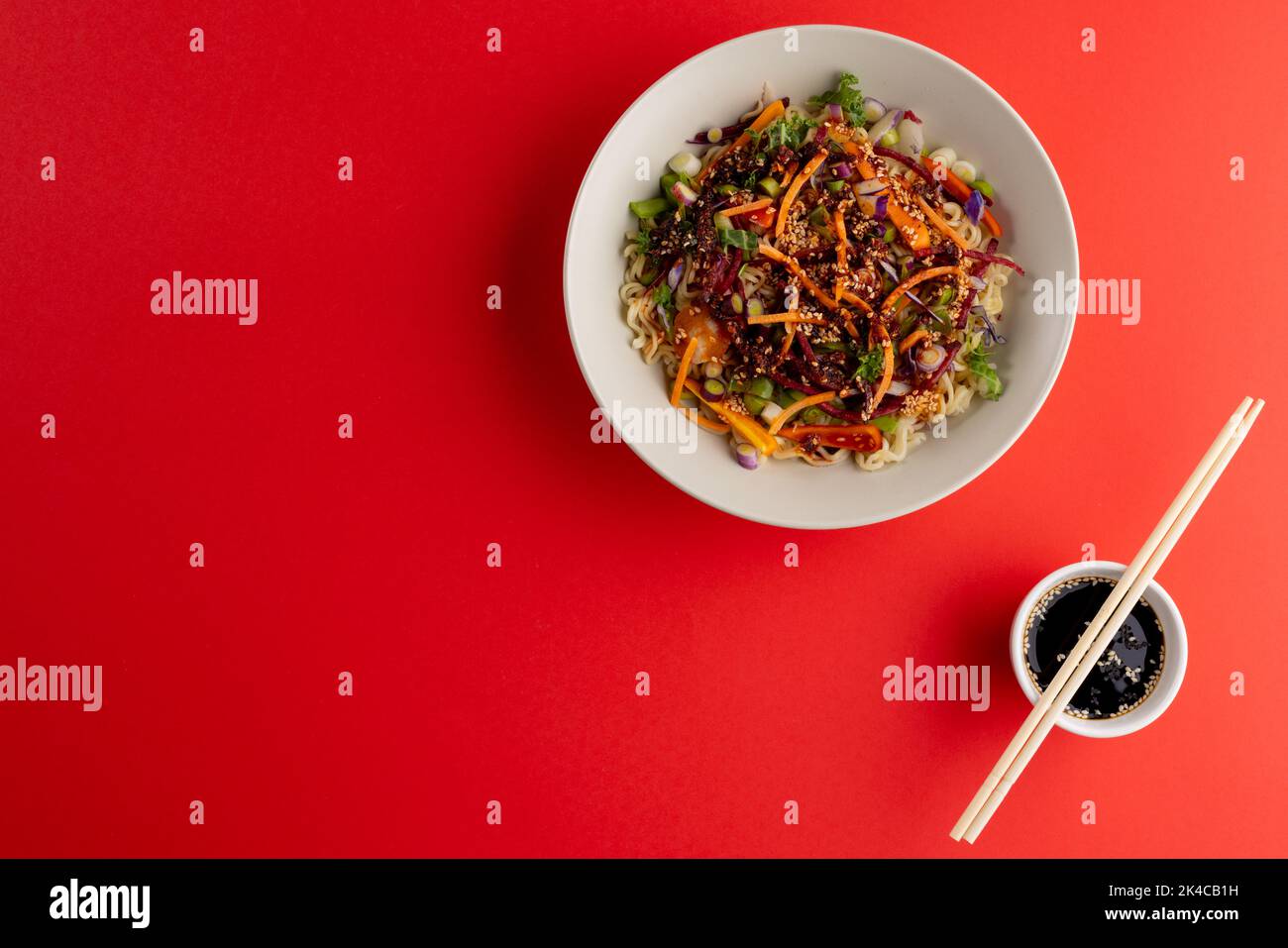 Overhead view of asian wok stir fry, soy sauce and chopsticks with copy ...
