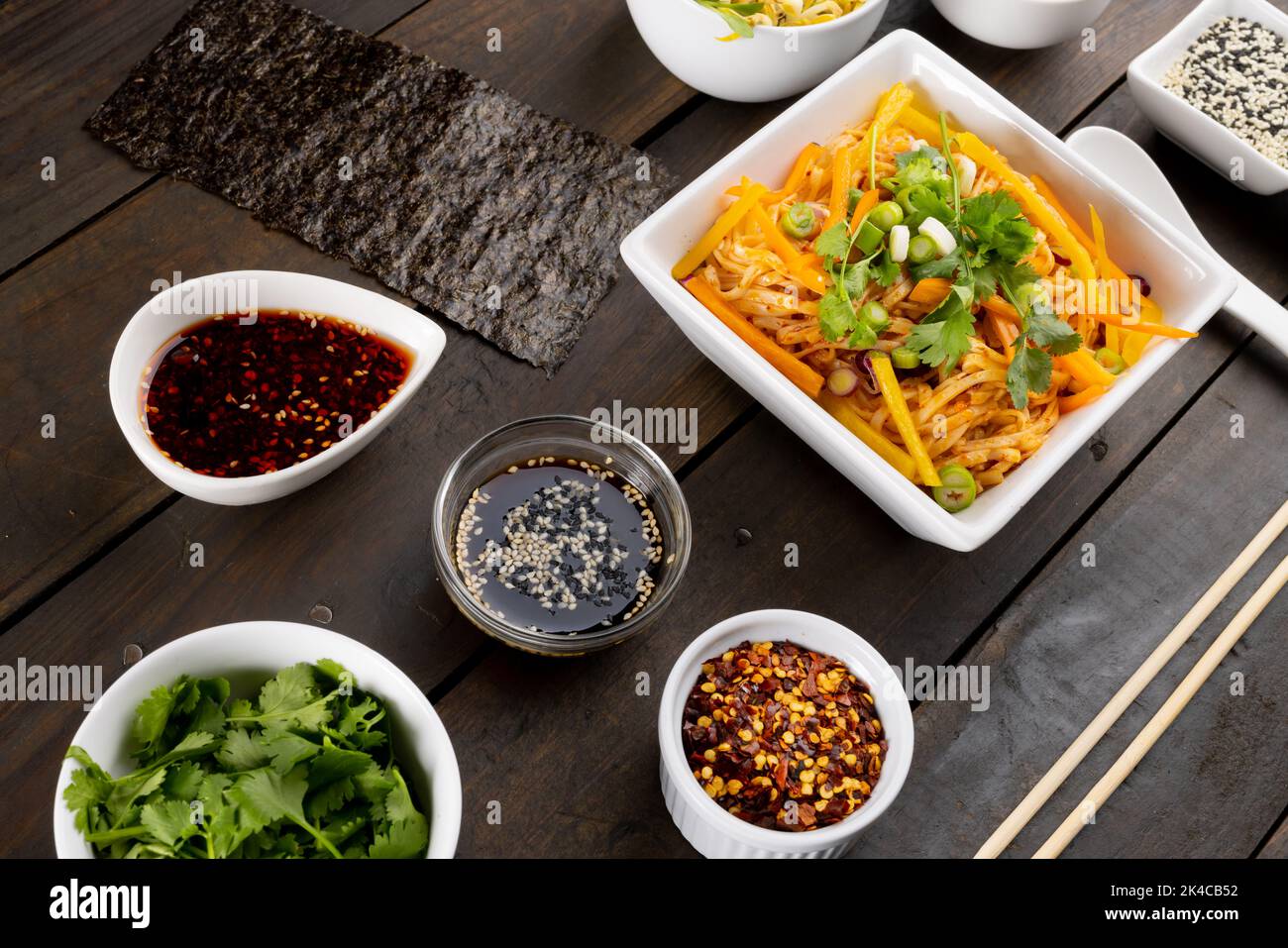 Overhead view of asian wok stir fry noodles with chopsticks and ...