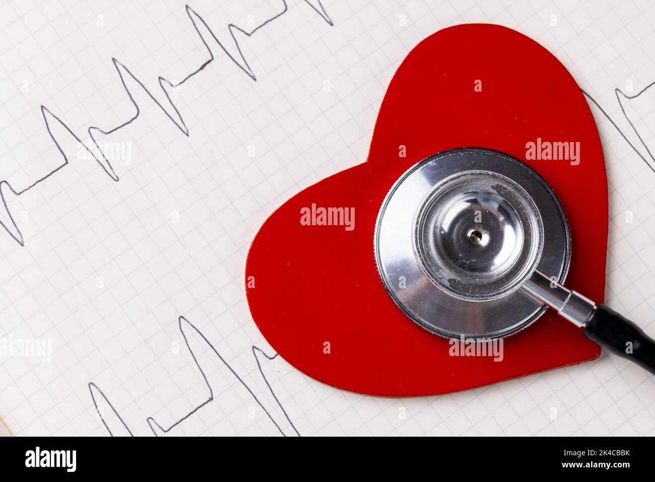 Image of red heart and stethoscope on white surface with heart rate ...