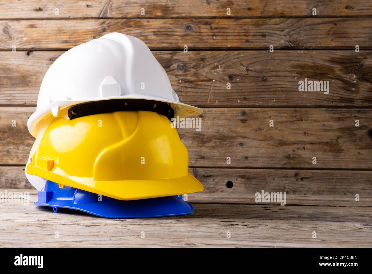Image of stack of helmets lying on wooden surface Stock Photo - Alamy